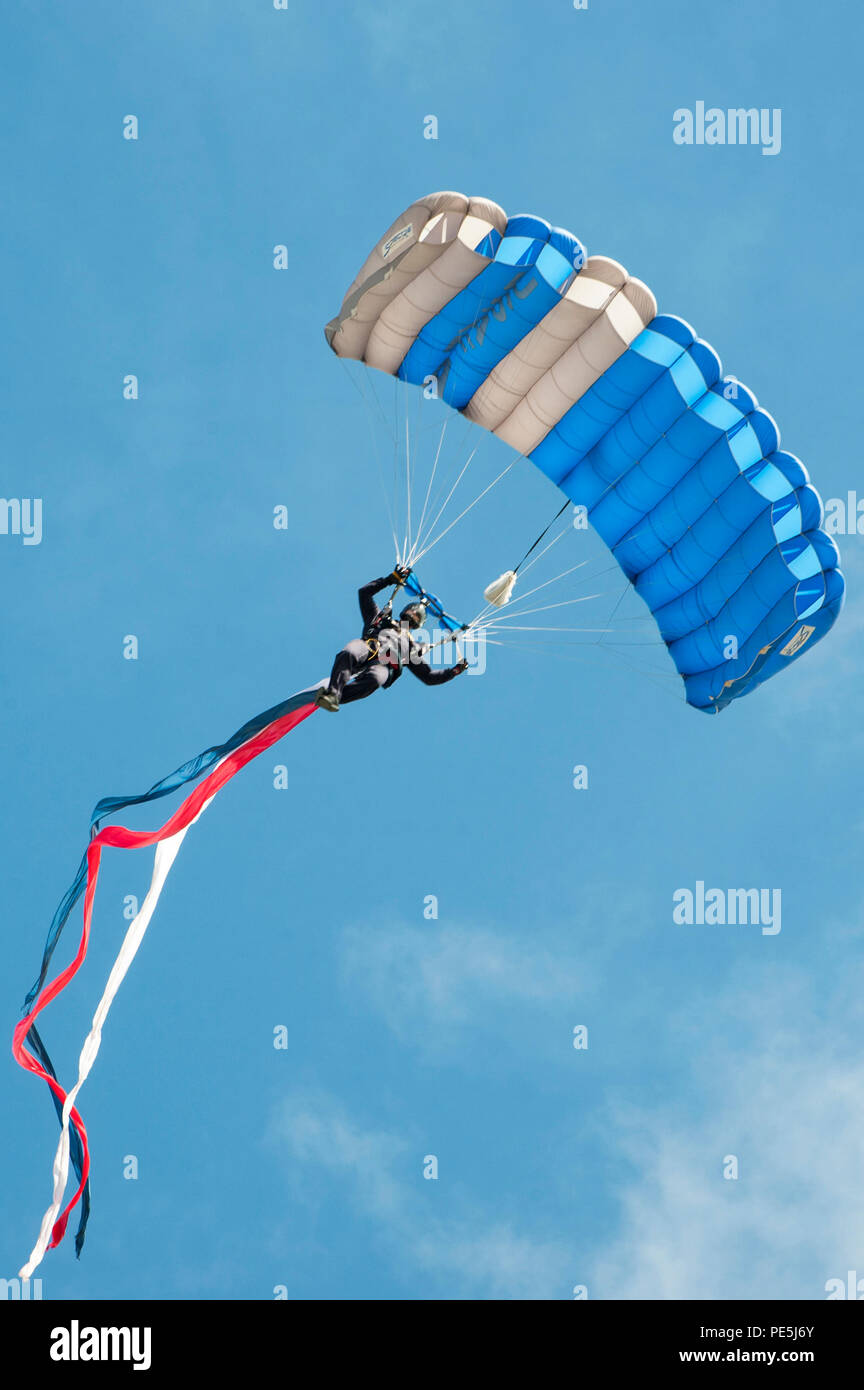 A member of the U.S. Air Force Academy Wings of Blue parachute team ...