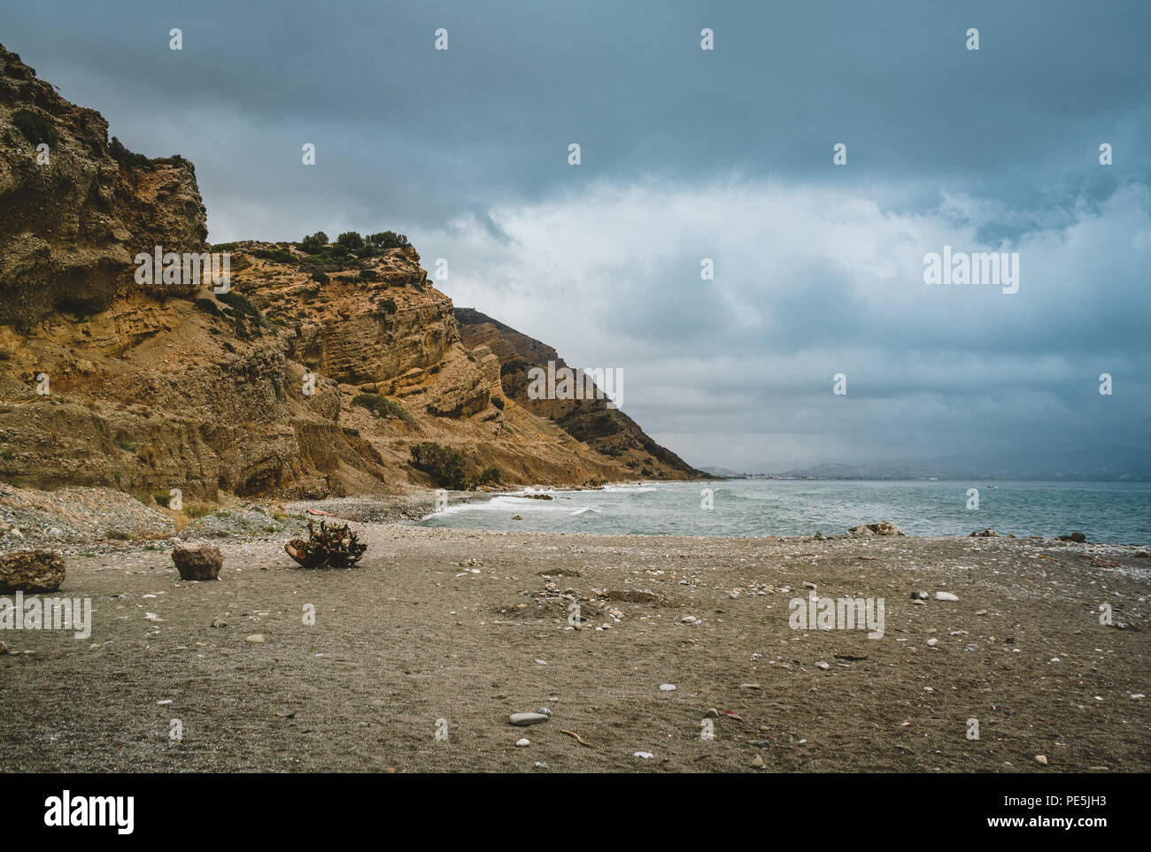 Typical beach scene in island crete. View towards ocean. With Mountains ...