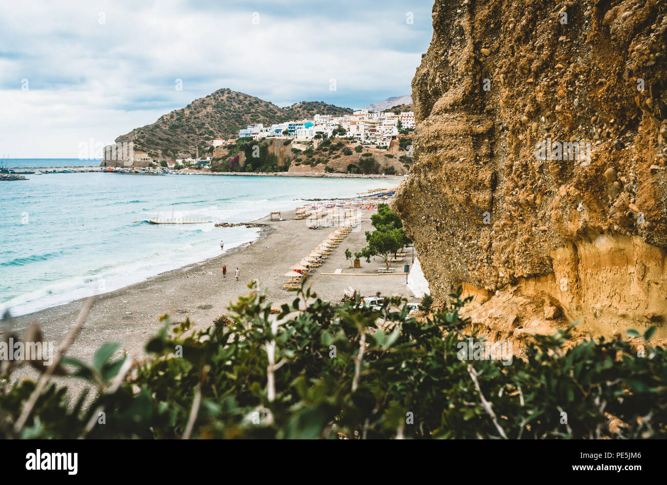 Crete, Greece. View from cliffs to village with marine vessels, boats ...