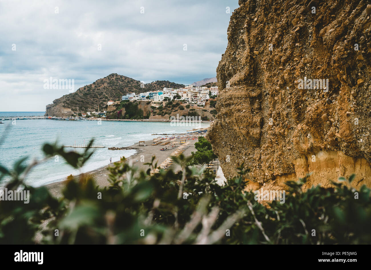 Crete, Greece. View from cliffs to village with marine vessels, boats ...