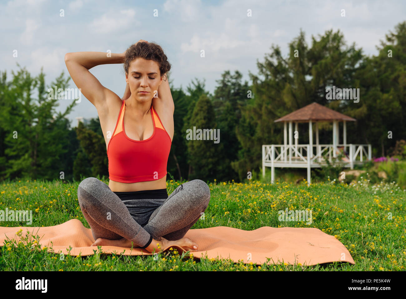 Yoga woman improving her flexibility stretching arms Stock Photo - Alamy