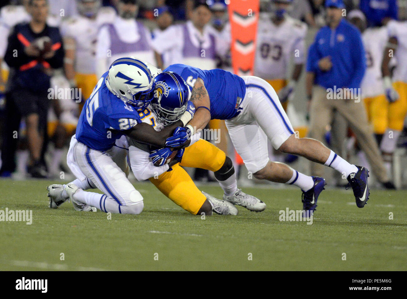 Falcon defensivemen Roland Ladipo and Connor Healy take down Spartans ...