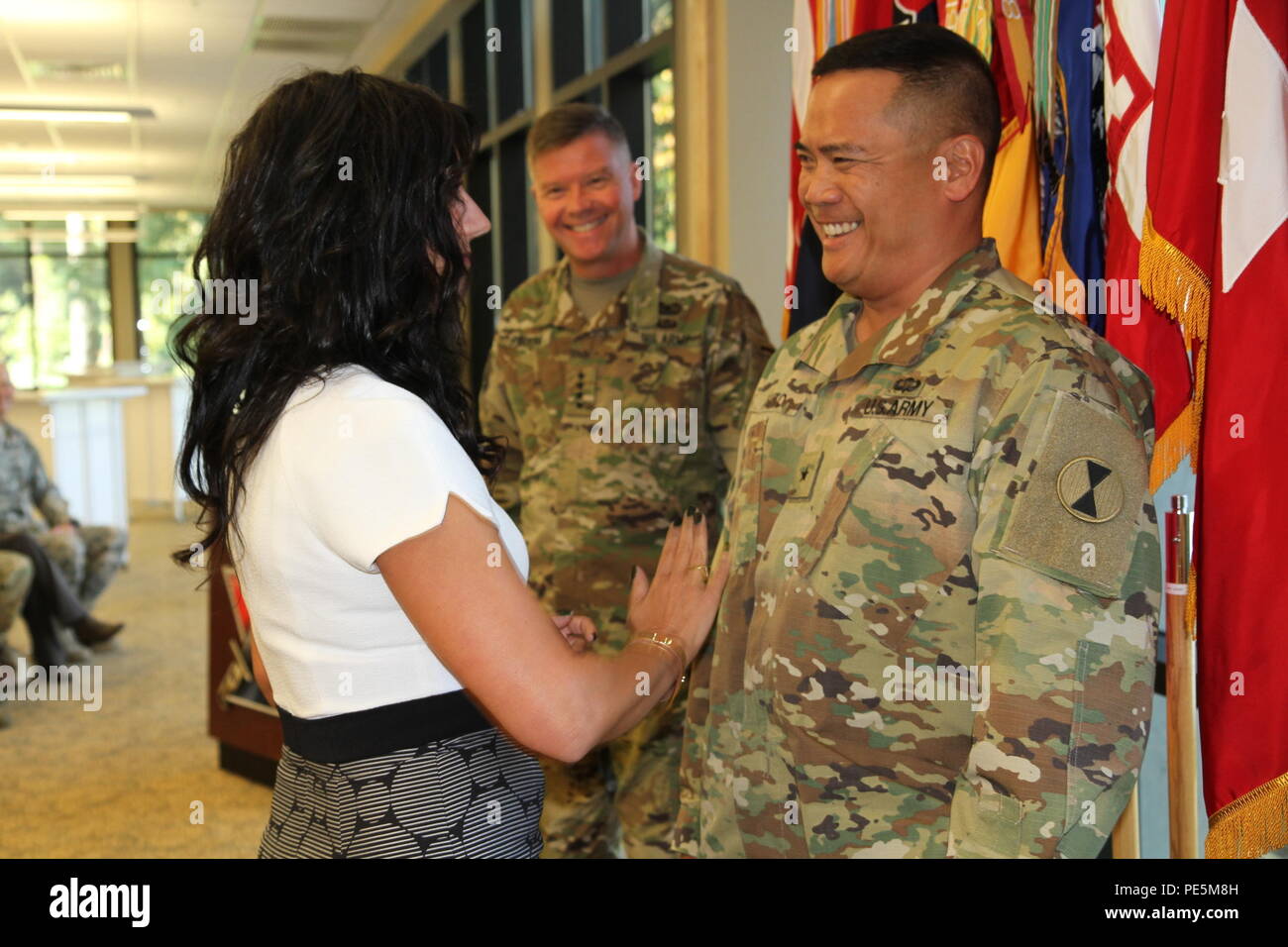 During his promotion ceremony, Brig. Gen. Antonio Aguto (right) has his ...