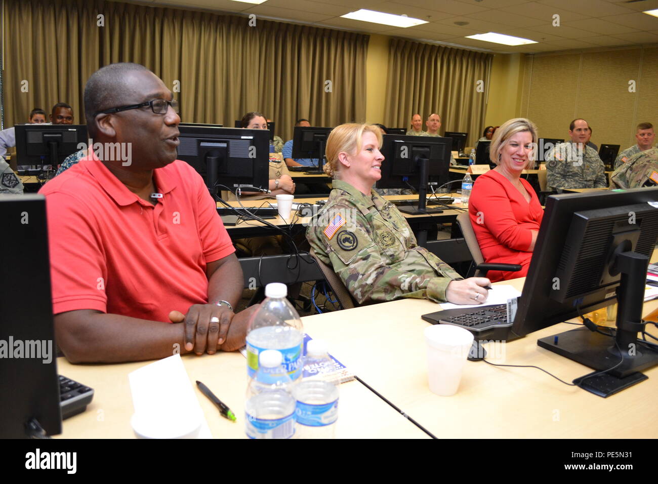 Department of Defense employees from across branches of service and ...