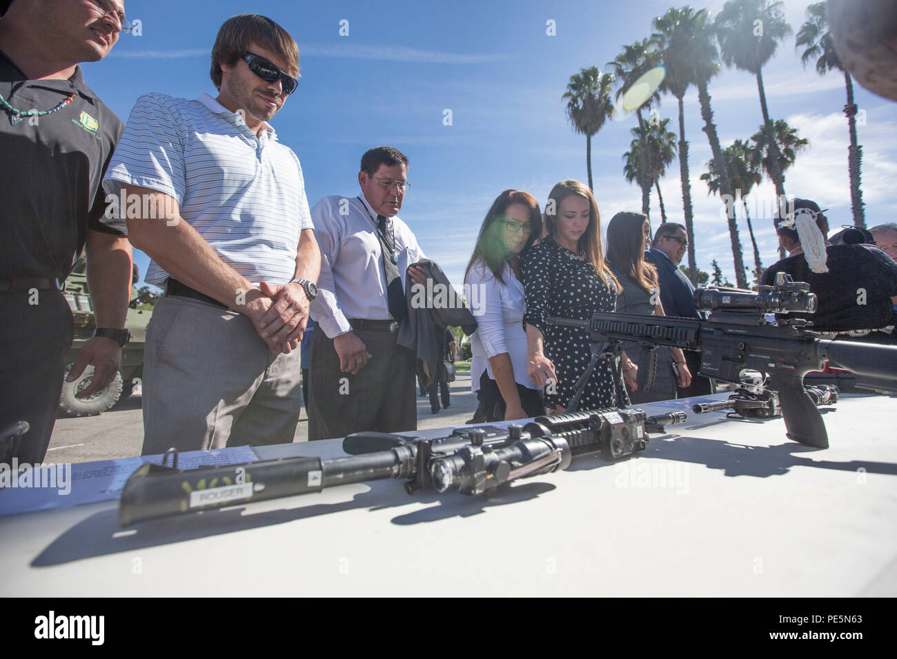 Members of the Navajo Nation look at a display of weapons during the ...
