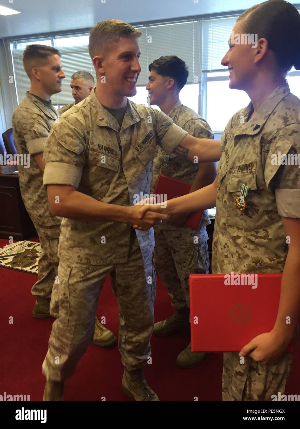 Lance Cpl. Mandaline Hatch, right, is congratulated by 1st Lt. Martin ...