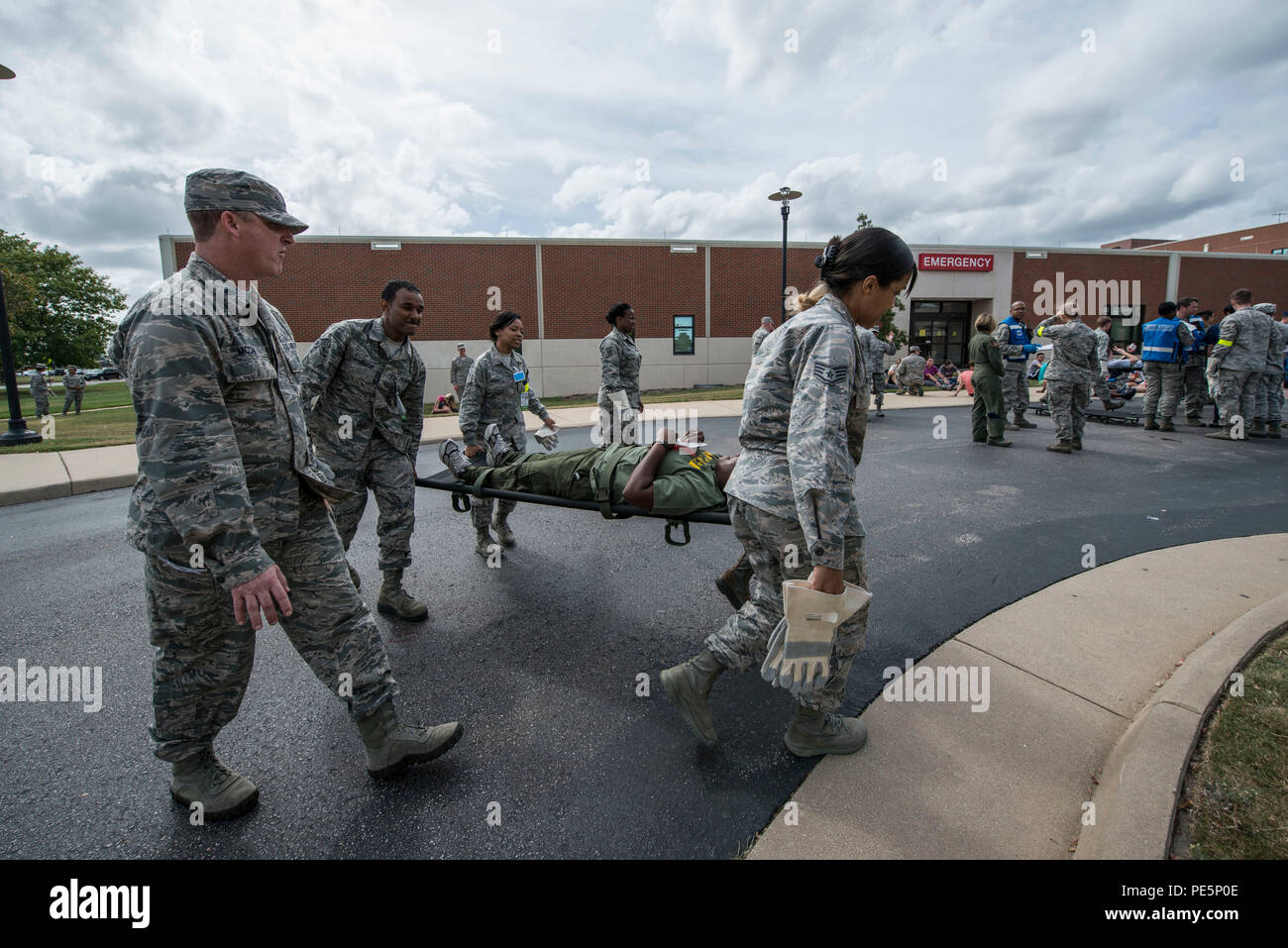 U.S. Air Force Airmen assigned to the 633rd Medical Group carry a ...