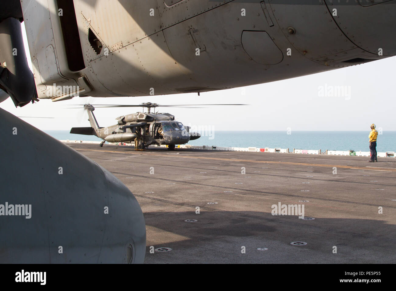 Seamen of the USS Essex and Soldiers of the 185th Theater Aviation ...