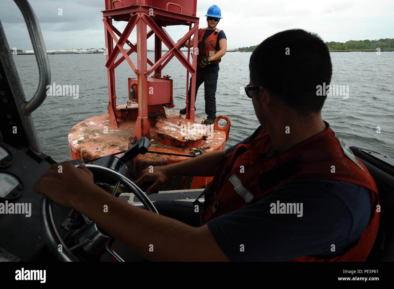 Petty Officer 2nd Class Geoff Haywood watches as Fireman Carrie ...