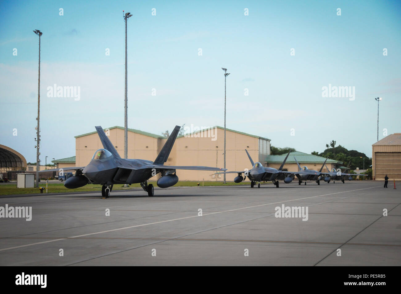 The Hawaii Air National Guard F-22 Raptors taxi through the tarmac on ...