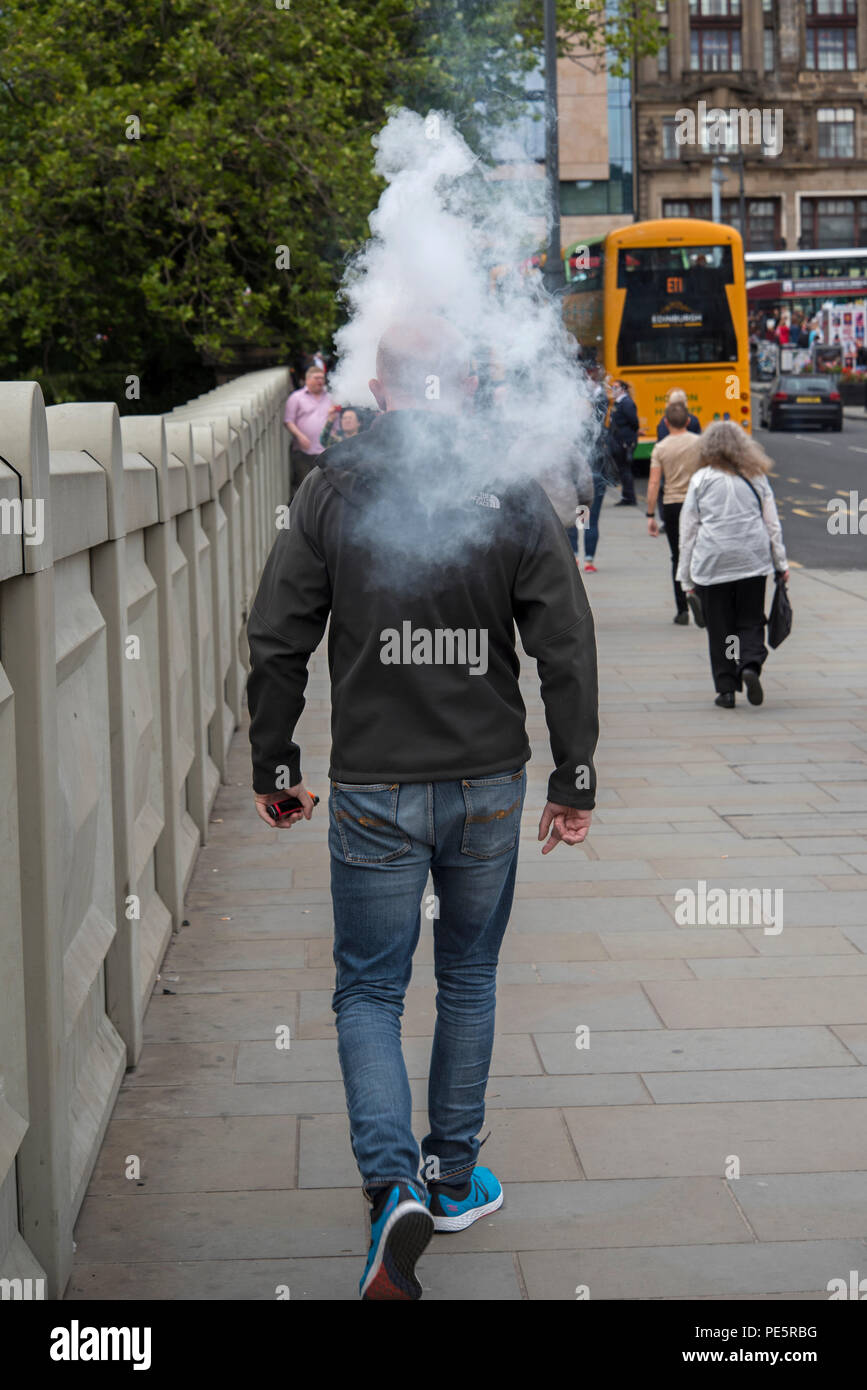 Smoking man walking street in hi-res stock photography and images - Alamy