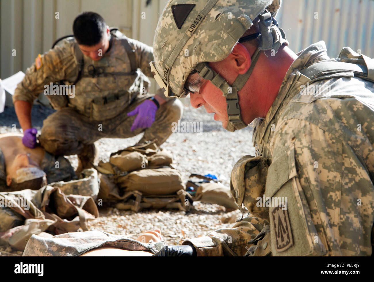 Spc. Kyle Little, right, a medic with 2nd Battalion, 44th Air Defense ...