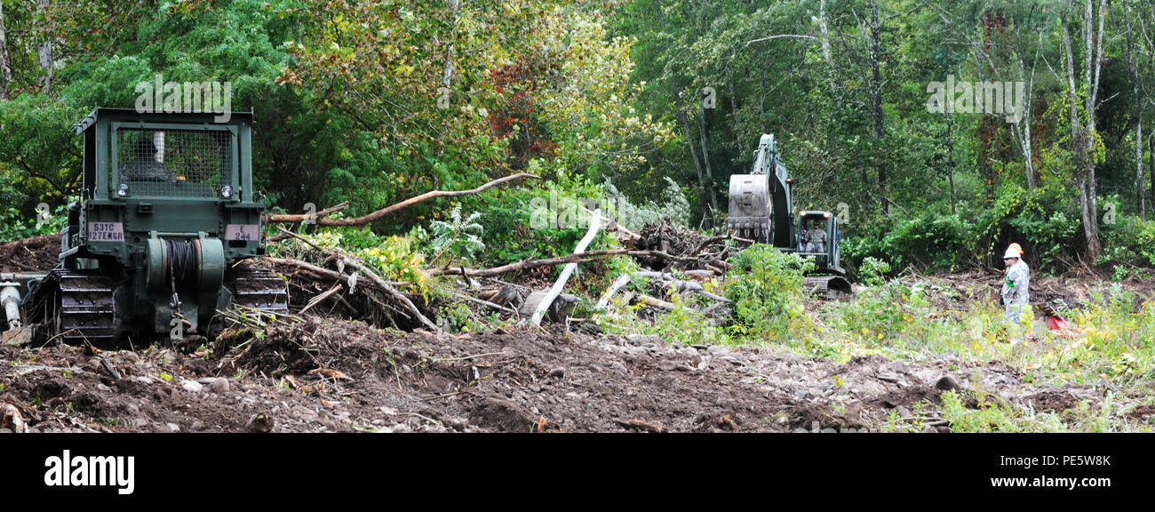 A New York Army National Guard D7 Bulldozer and hydraulic excavator ...