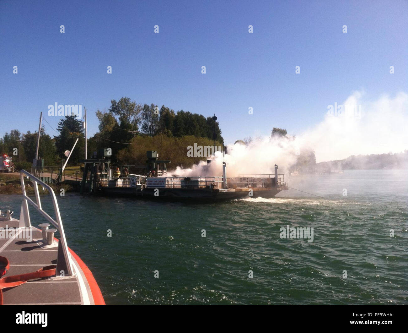 A vehicle burns aboard the passenger vessel Charlevoix, a 50-foot, four ...