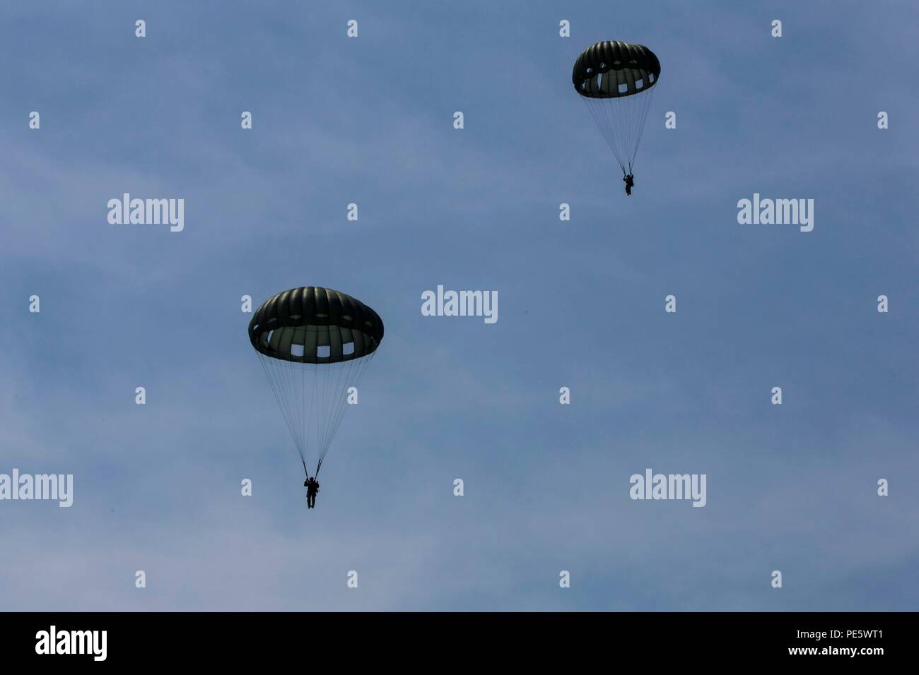 U.S. Marines, with 3rd Reconnaissance Battalion, parachutes from a MV22 ...