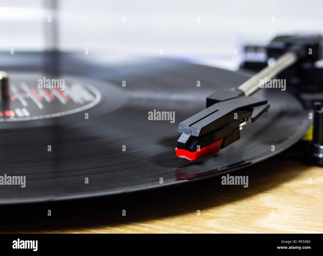 Playing a vinyl record on a record player Stock Photo - Alamy