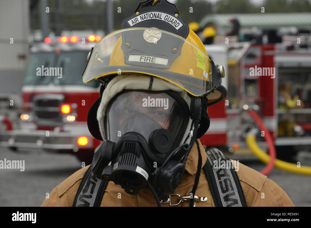 U.S. Air Force firefighter Staff Sgt. Giuseppie Sirigu moves toward the ...