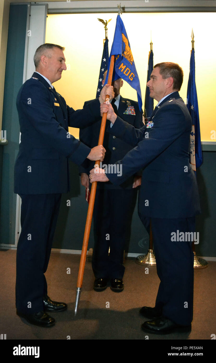Col. Howard Eissler, 111th Attack Wing commander, hands the medical ...
