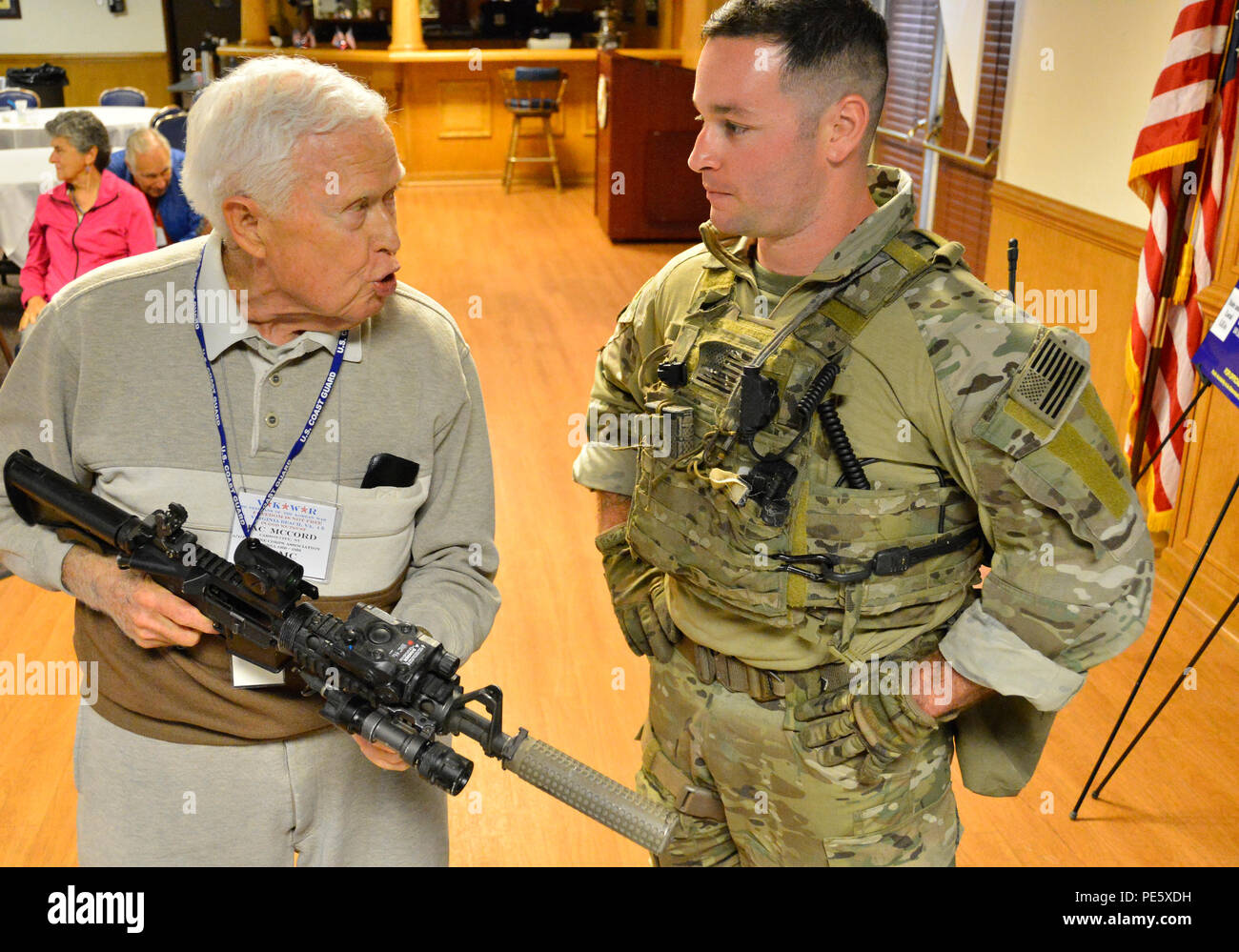 Petty Officer 2nd Class Justin Iulo (right), a maritime enforcement ...