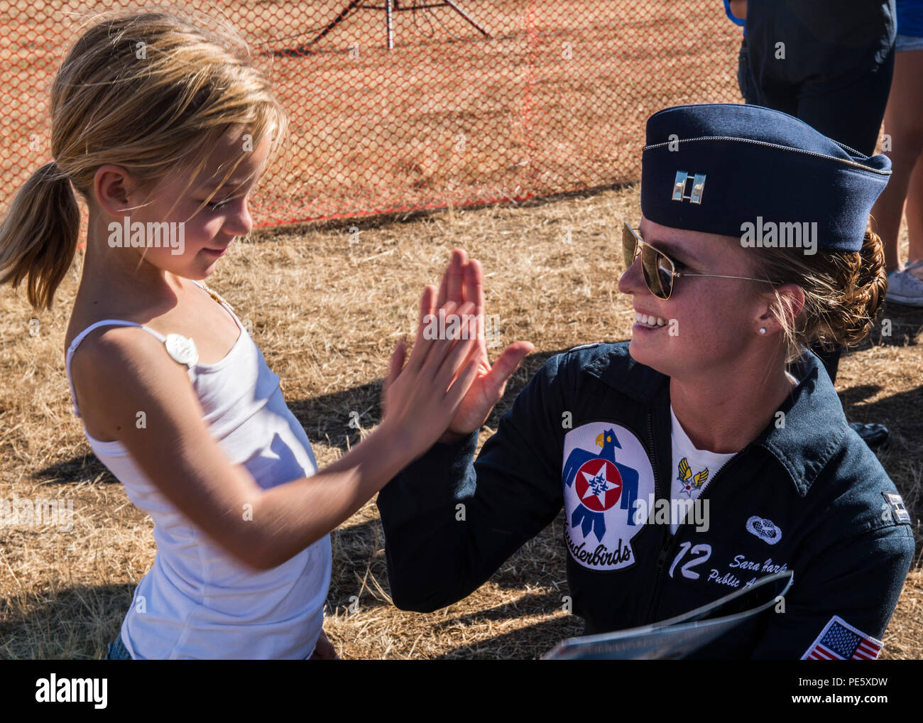 Capt. Sara Harper, Thunderbird 12, high fives a young fan, Oct. 2, 2015 ...