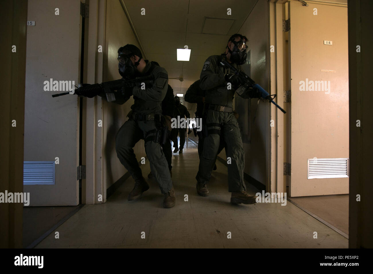 The Special Reaction Team sweeps through a building Sept. 23 during an ...