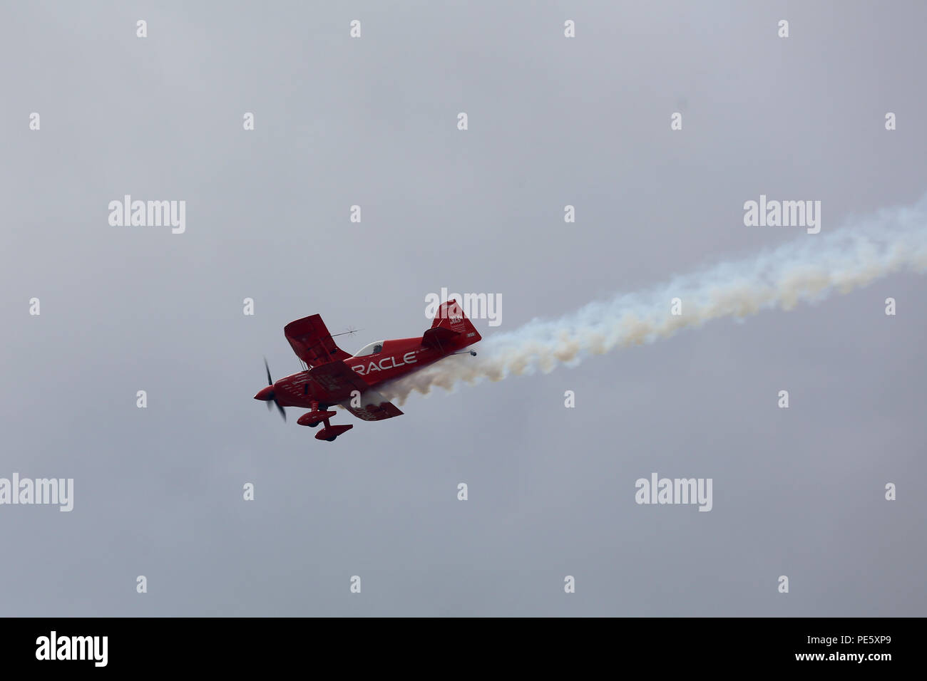 Sean D. Tucker, Oracle Challenger pilot, glides just above the runway ...