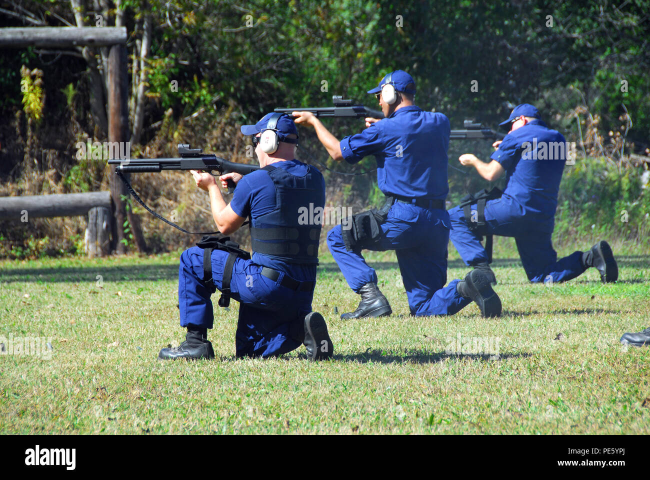 Crew members from Coast Guard Station Harbor Beach, Mich., take aim ...