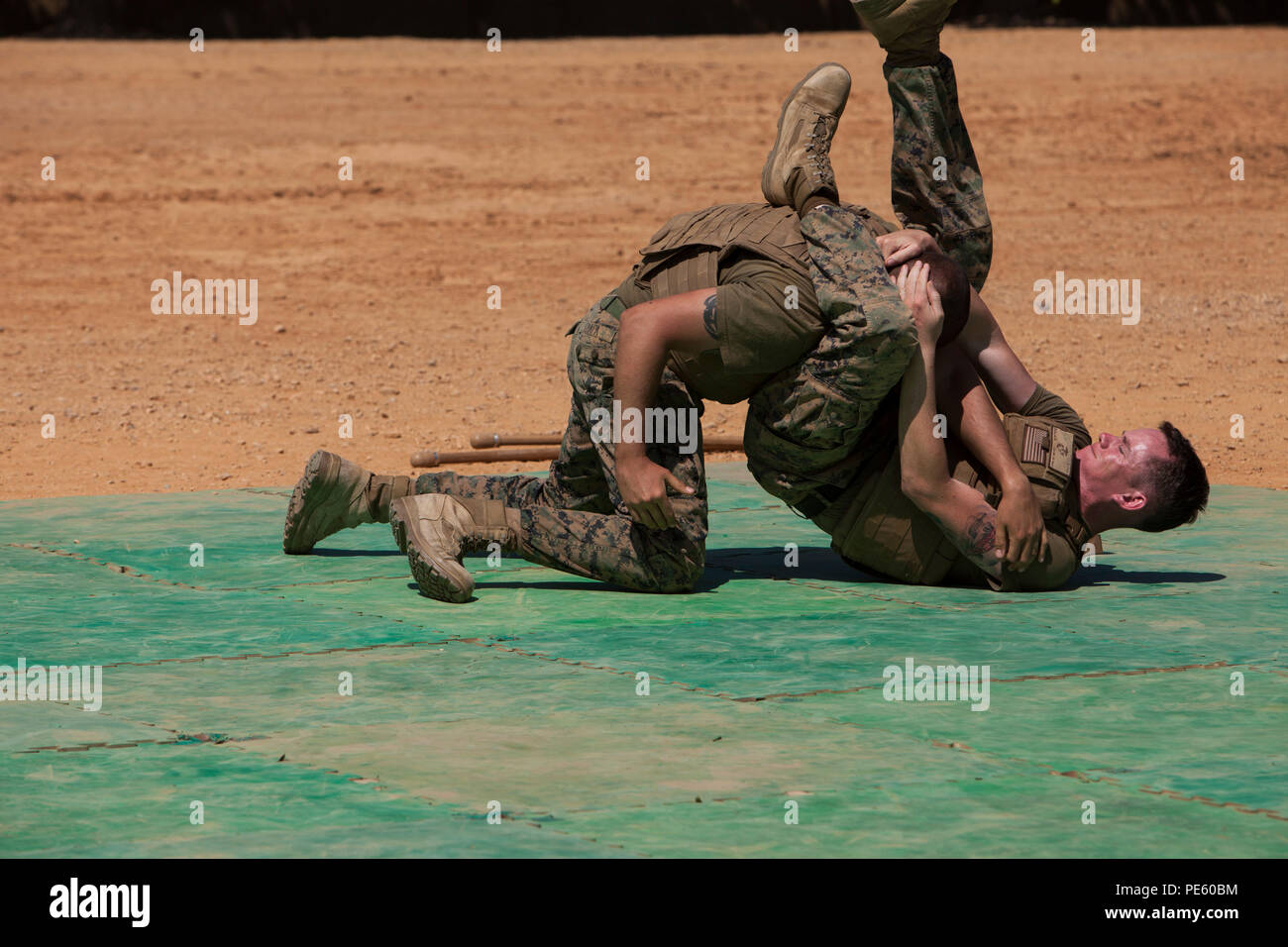 Sgt. Nick J. Bidlack, right, demonstrates ground fighting techniques ...
