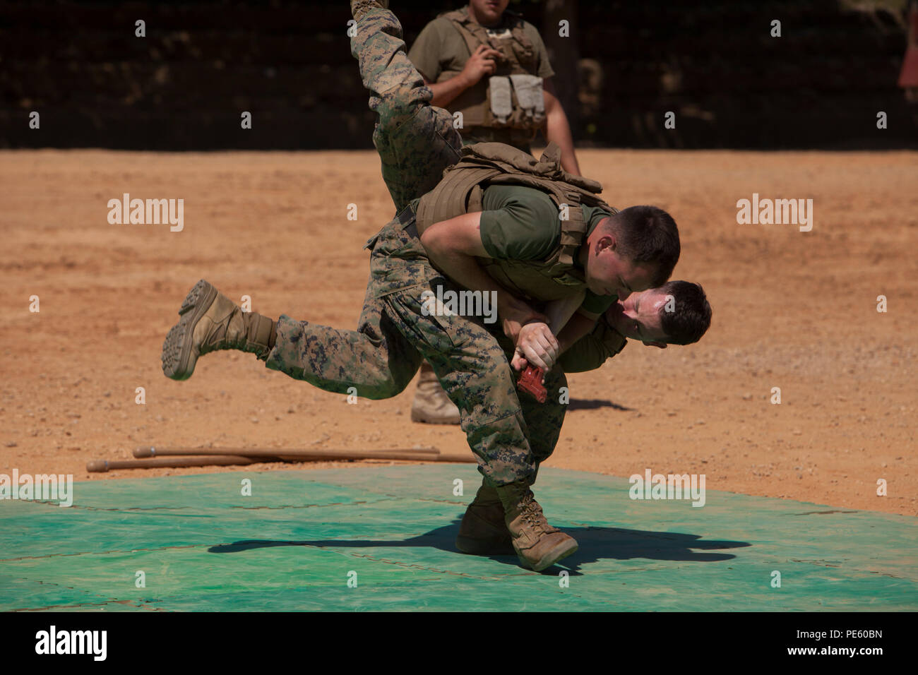 Cpl. Michael J. Chapman, front, disarms and incapacitates Sgt. Nick J ...