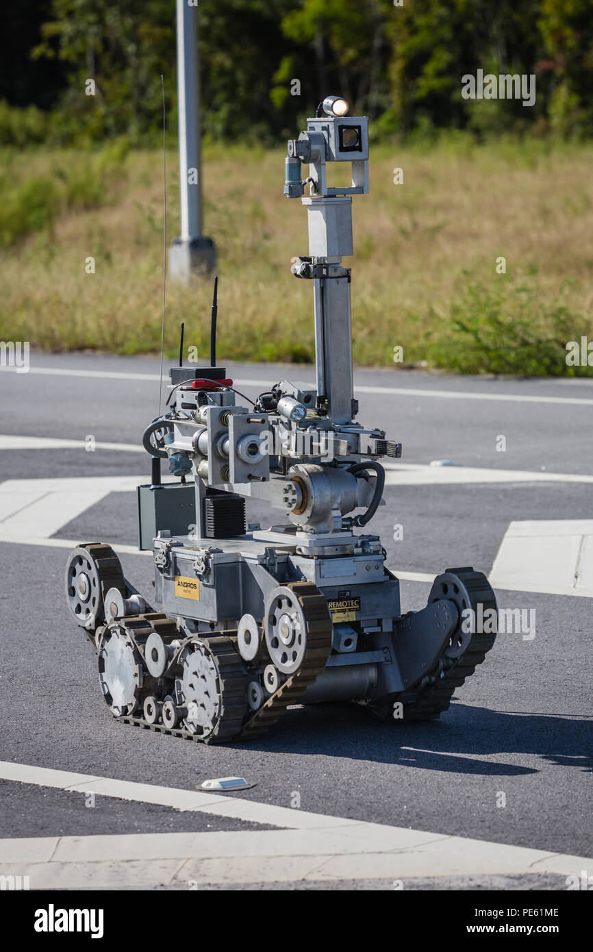 A remote controlled military vehicle moves towards a simulated ...