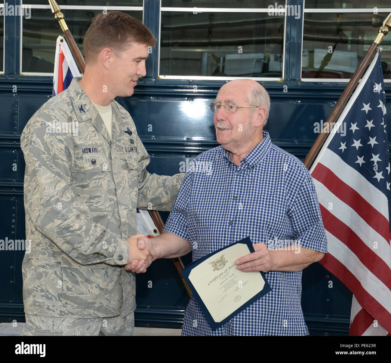 U.S. Air Force Col. John Howard, left, 100th Air Refueling Wing vice ...