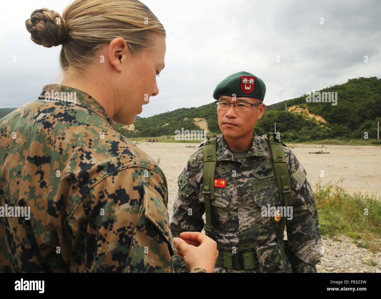 Republic of Korea Marine Lt. Col. Jong Je Kim, right, speaks with U.S ...