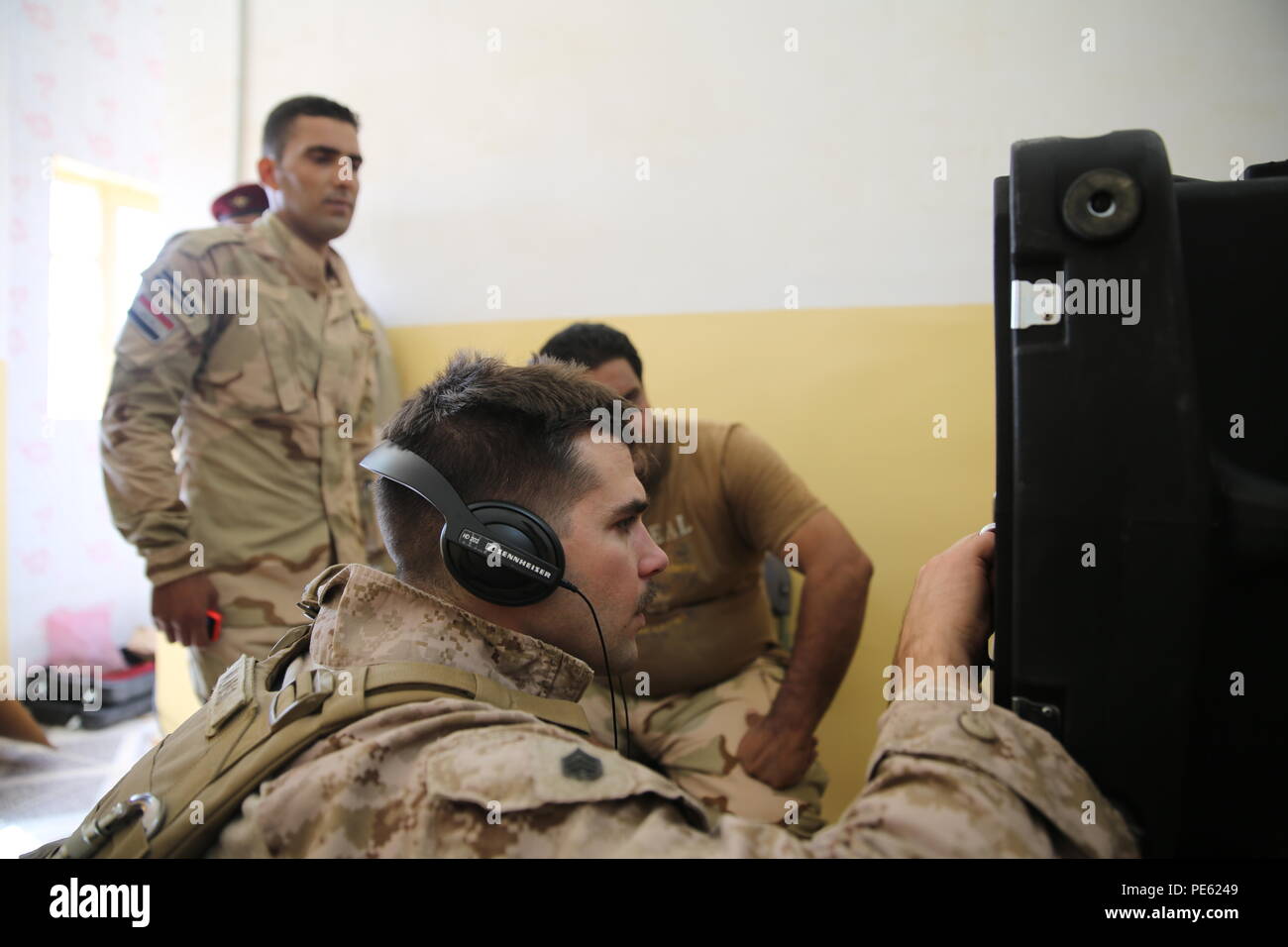 U.S. Marine Staff Sgt. Eric Alabiso, an information operations advisor ...