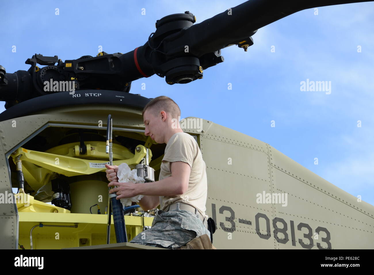 Pfc. Jesse Watson from 2-159th ARB conduct routine maintenance on a CH ...