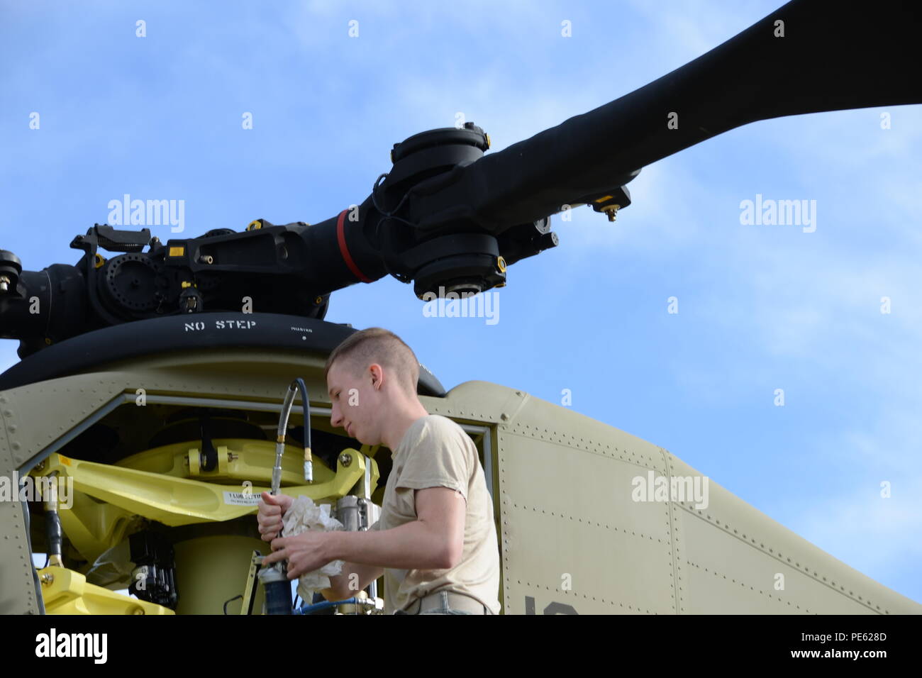 Pfc. Jesse Watson from 2-159th ARB conduct routine maintenance on a CH ...