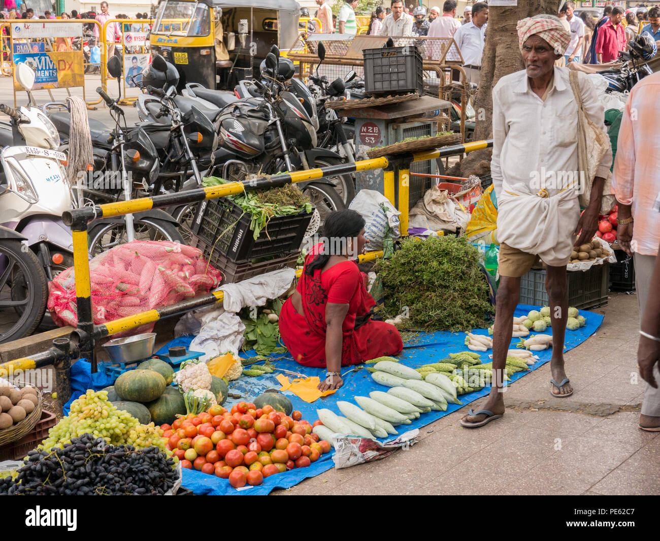 Mysore, India - January 2018. Indians sell their goods on the street ...