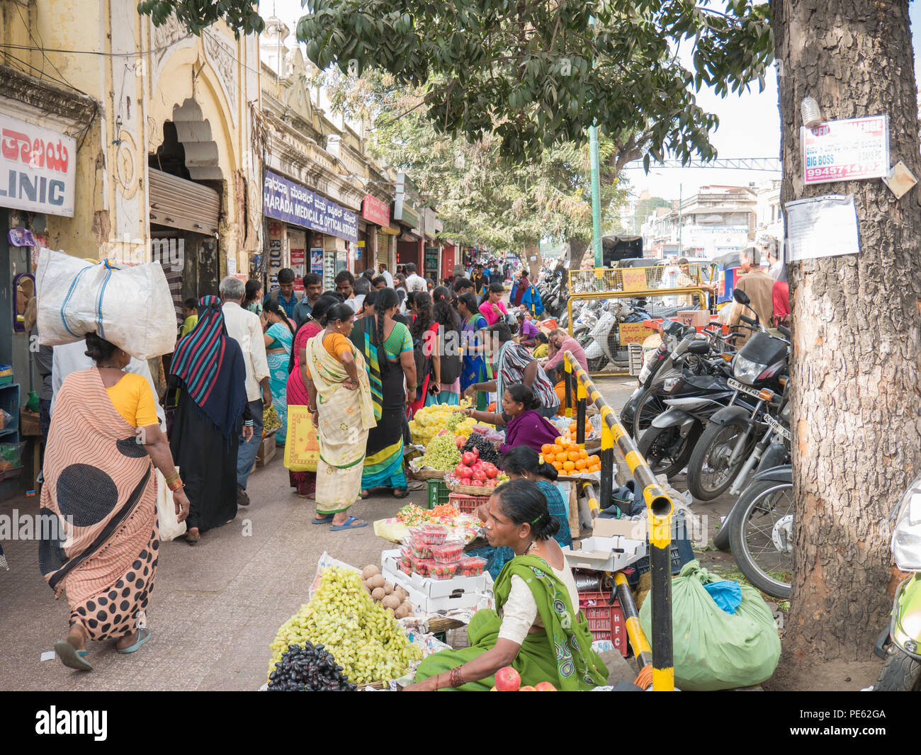 Mysore, India - January 2018. Indians sell their goods on the street ...
