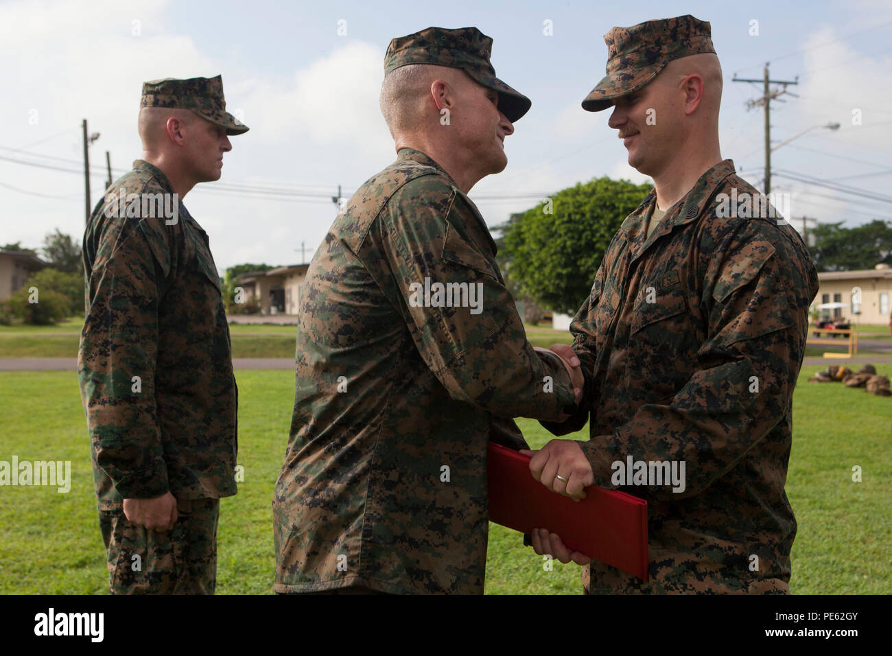 U.S. Marine Corps Lt. Col. David T. Hudak, center, Commanding Officer ...