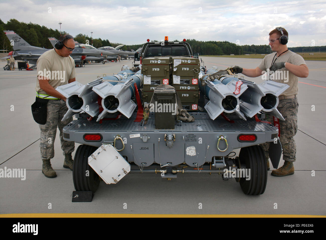 U.S. Air Force Staff Sgt. Victor Jeng, left, aircraft armament ...