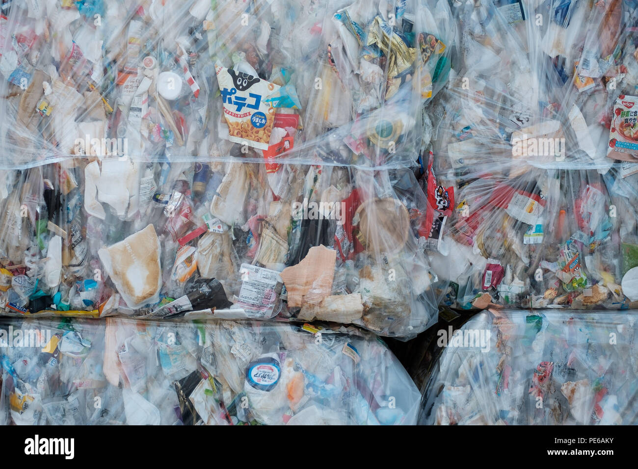 Pictures shows compressed plastic waste at Ichikawa Kankyo Engineering ...