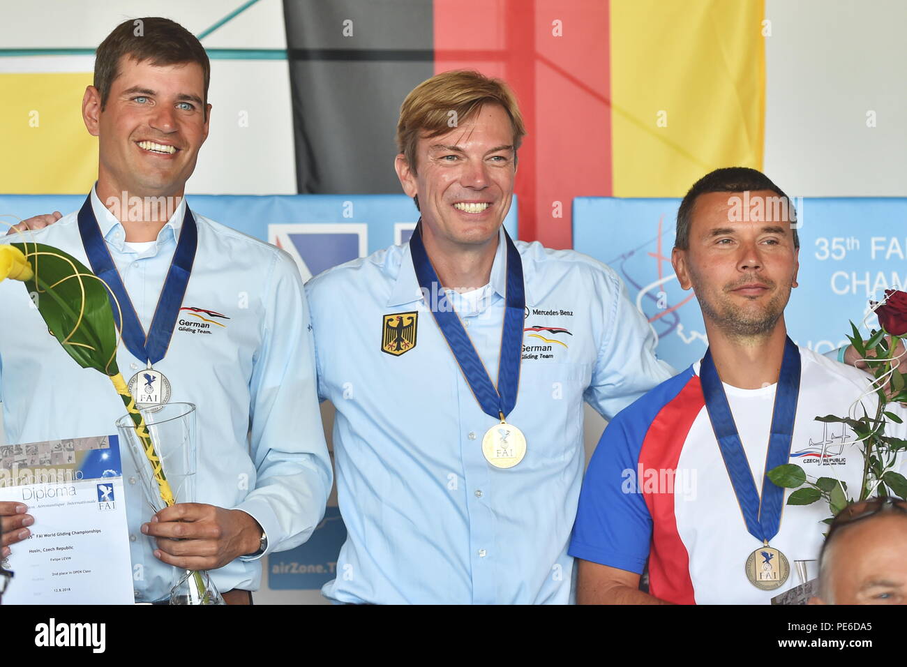 (L-R) Second placed Felipe Levin of Germany, winner Michael Sommer of ...