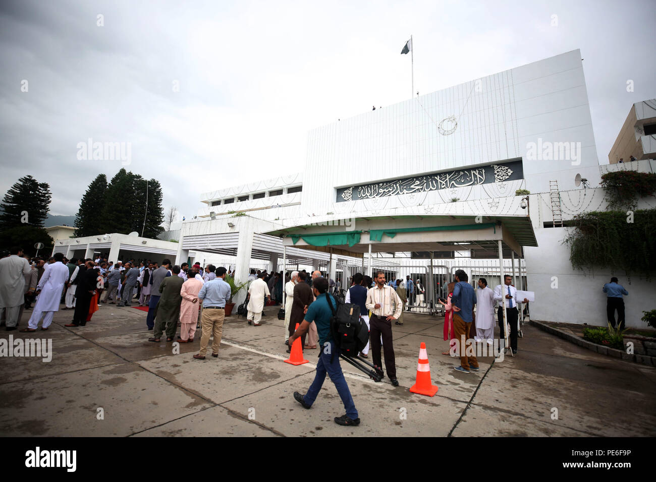 Islamabad, Islamabad. 13th Aug, 2018. People gather outside the ...