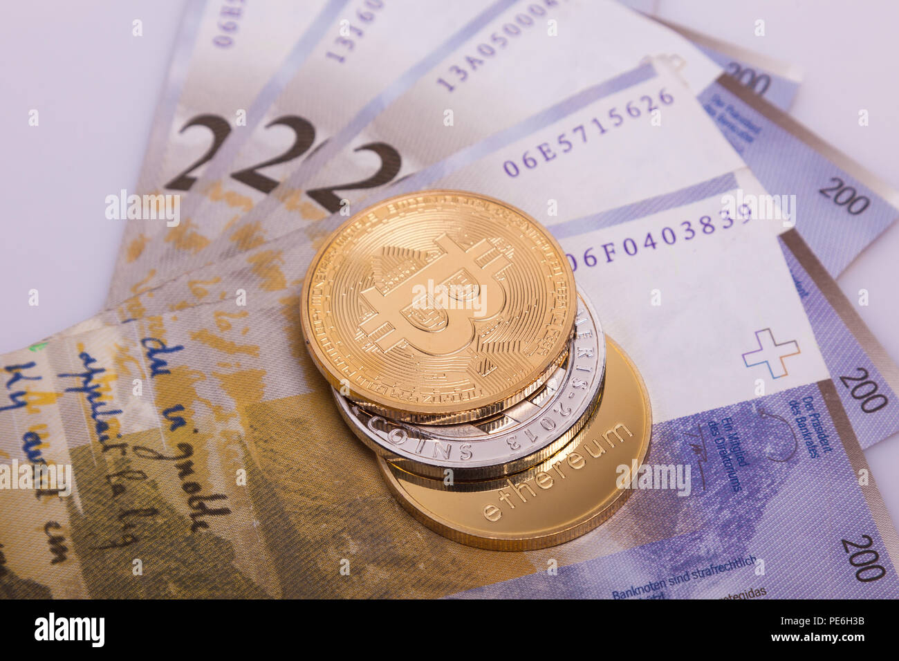 Bitcoin btc crypto currency coin over swiss francs bank notes Stock ...