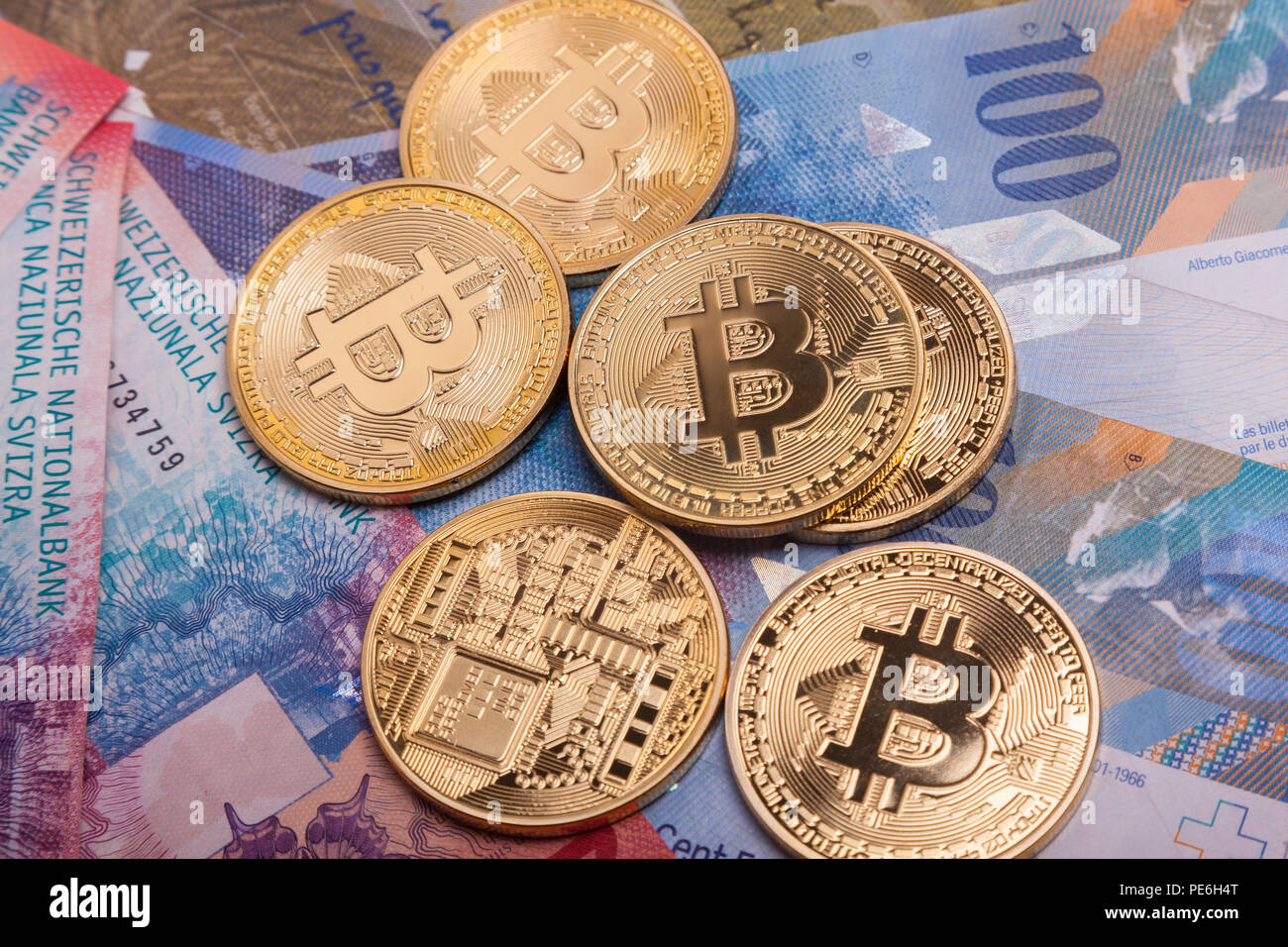Bitcoin btc crypto currency coin over swiss francs bank notes Stock ...