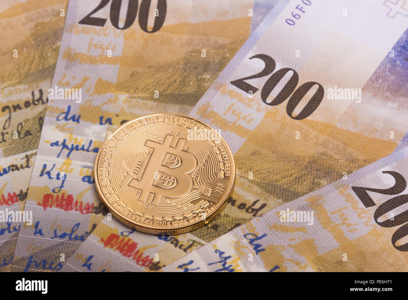 Bitcoin btc crypto currency coin over swiss francs bank notes Stock ...