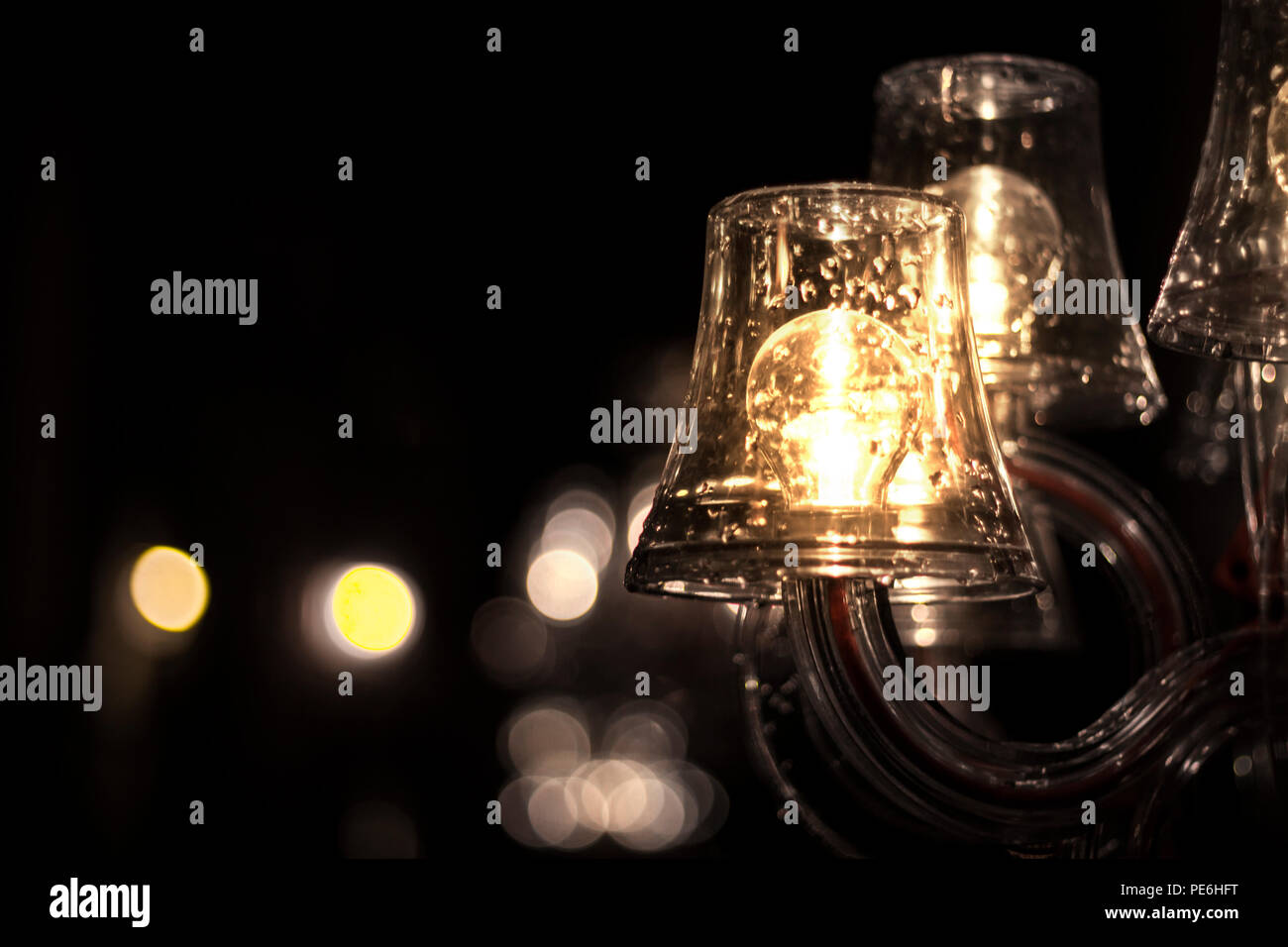 Electrical lid chandelier with water on it in a dark night Stock Photo ...
