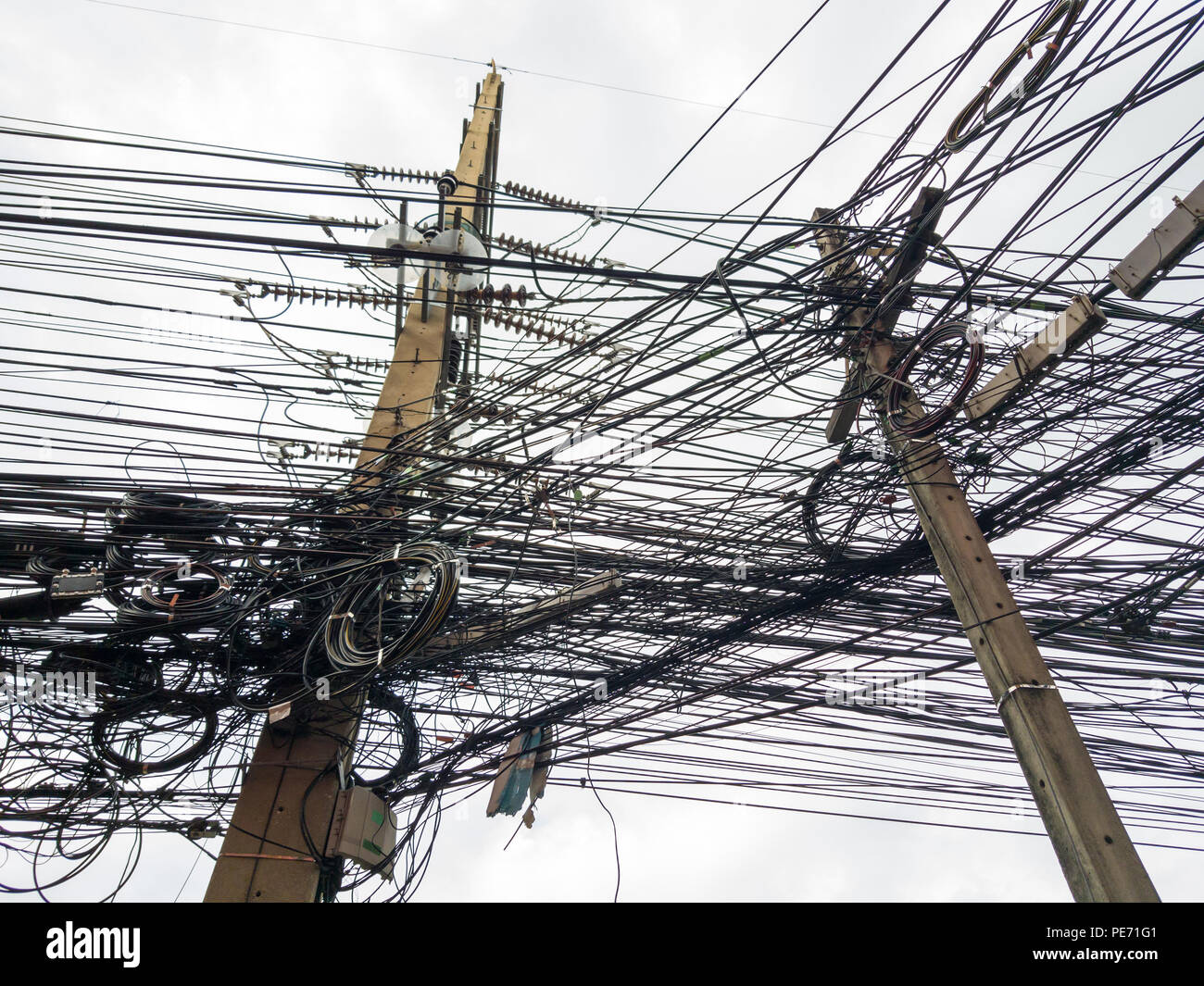 Electricity wire and communication cables is tangle Stock Photo - Alamy