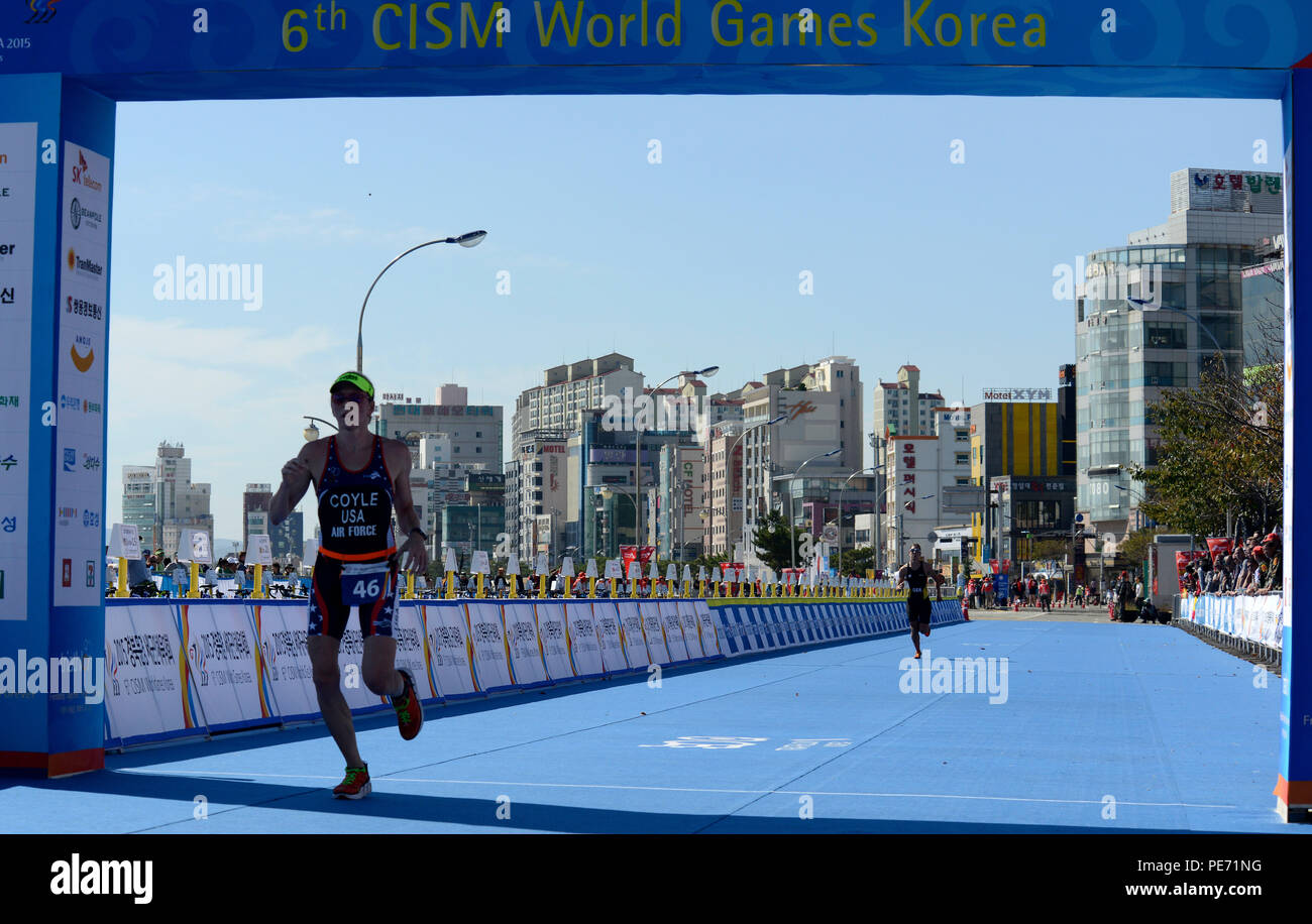 U.S. Air Force Maj. Judith Coyle crosses the finish line of the women's ...
