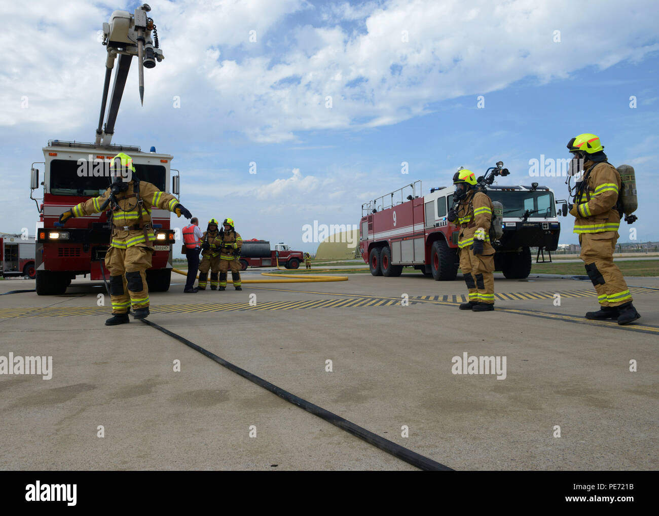 Firefighters from the 39th Civil Engineer Squadron proceed through a ...
