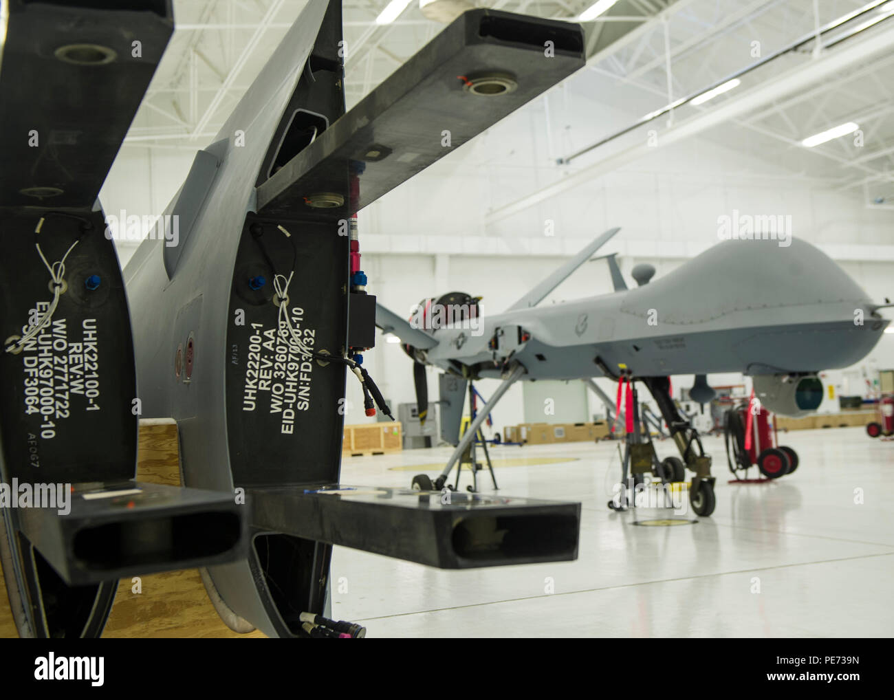 An MQ-9 Reaper sits in a hangar prior to having the wings put on at ...